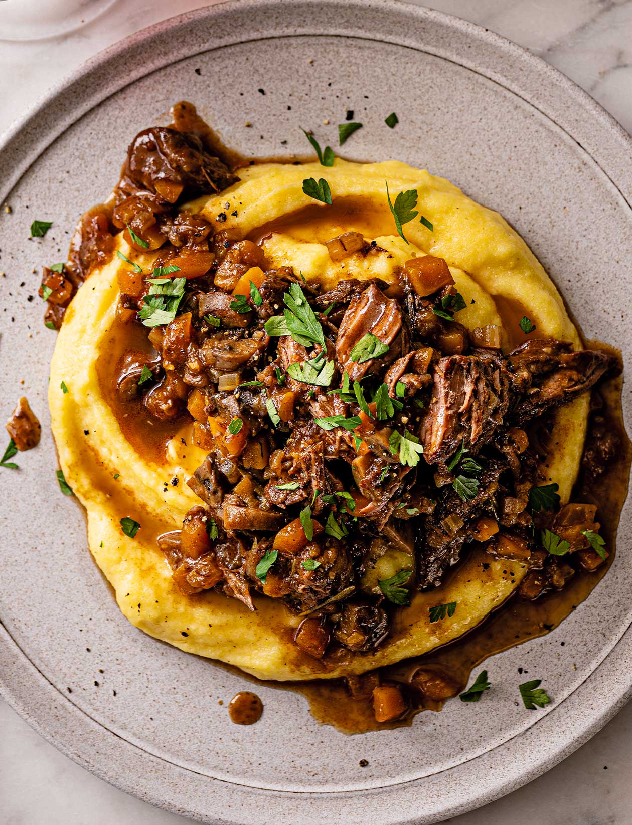 Slow-cooked beef shin with creamed polenta recipe | Sainsbury`s Magazine