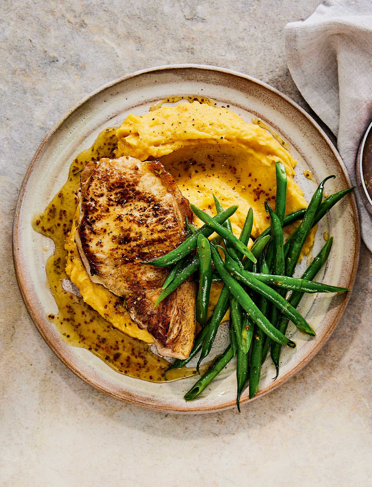 Marmalade-glazed pork chops with spiced carrot and swede mash recipe ...