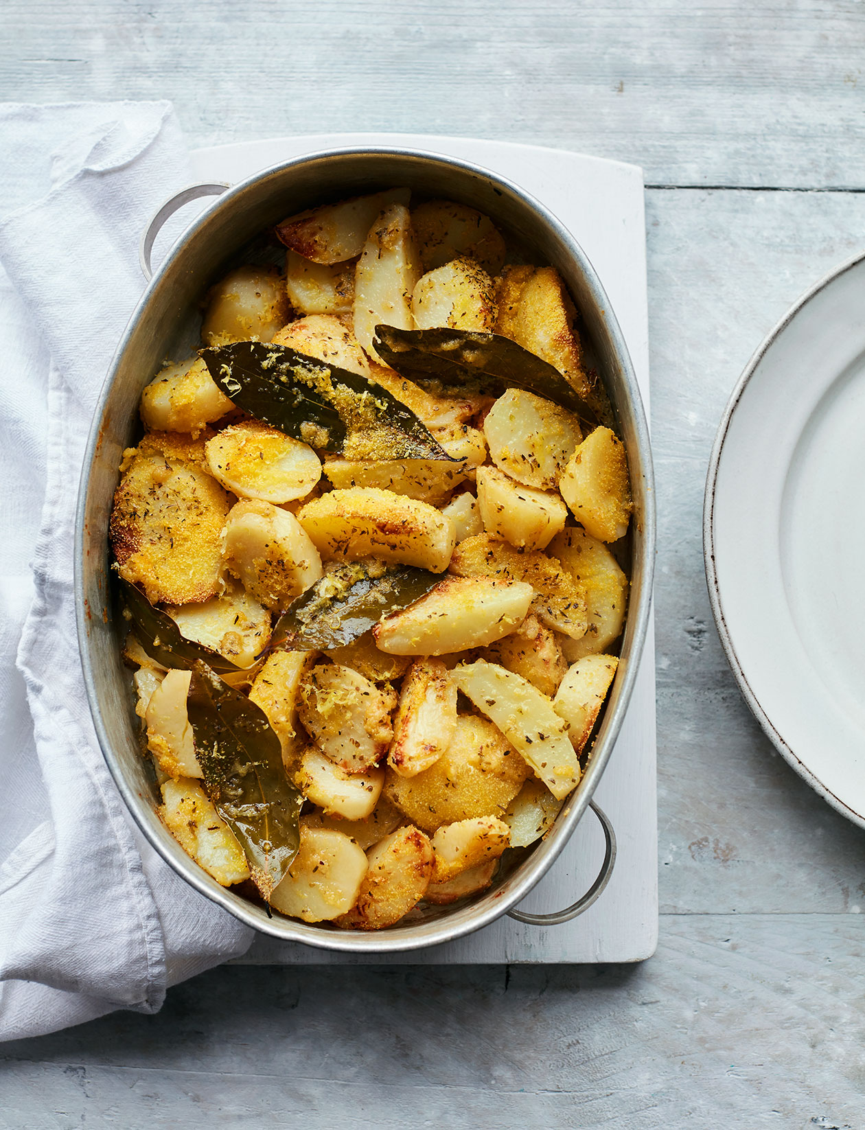 Greek-style lemon and bay potatoes recipe | Sainsbury`s Magazine