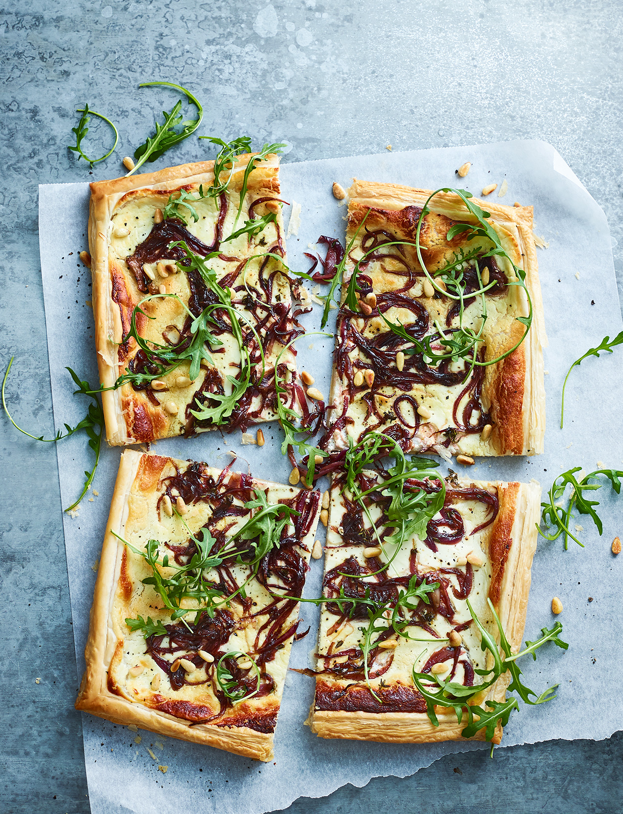 Balsamic onion, goats' cheese and rocket tart recipe | Sainsbury`s Magazine